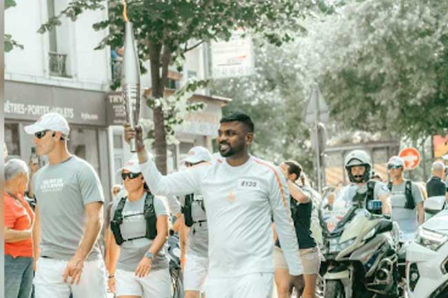 Tarshan, who was born in Sri Lanka, carried the torch of the Paris Olympics